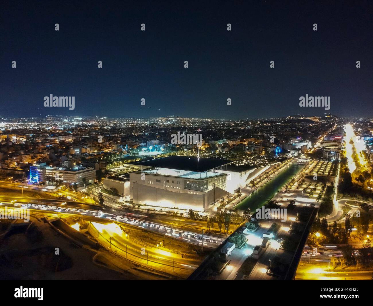 Aerial cityscape view of southern Athens at night. Centered the ...