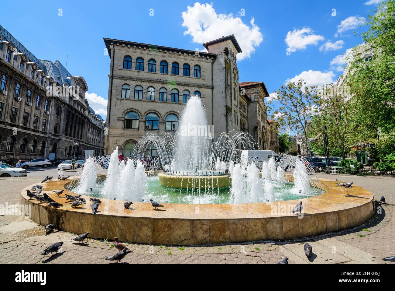 Bucharest, Romania - 6 May 2021: Water fountain and Ion Mincu ...