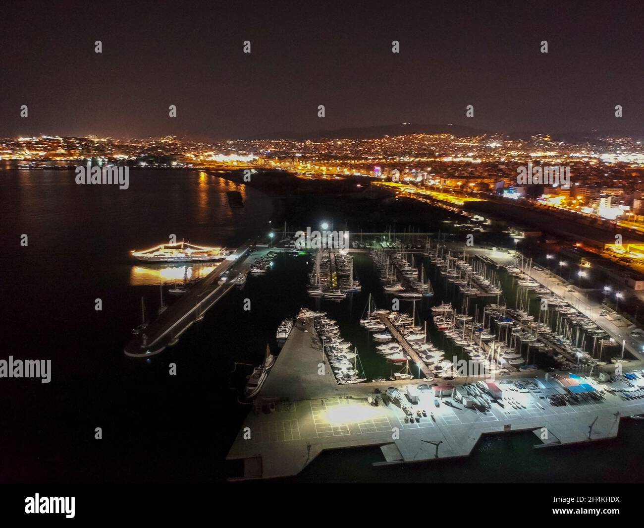Aerial view over Marina at Flisvos in Athens city, Greece at night ...