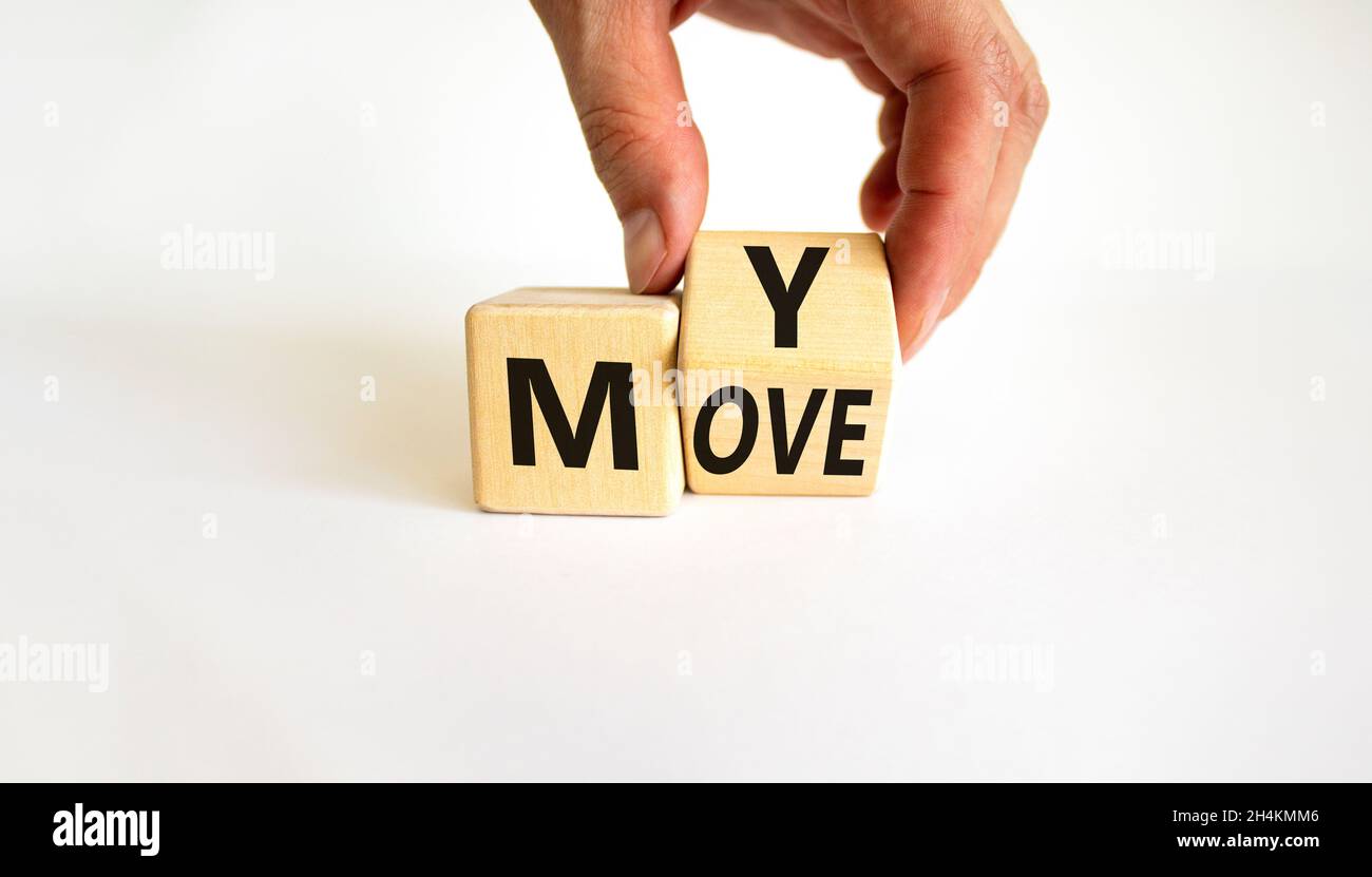 Make my move symbol. Businessman turns the wooden cube with words 'My ...