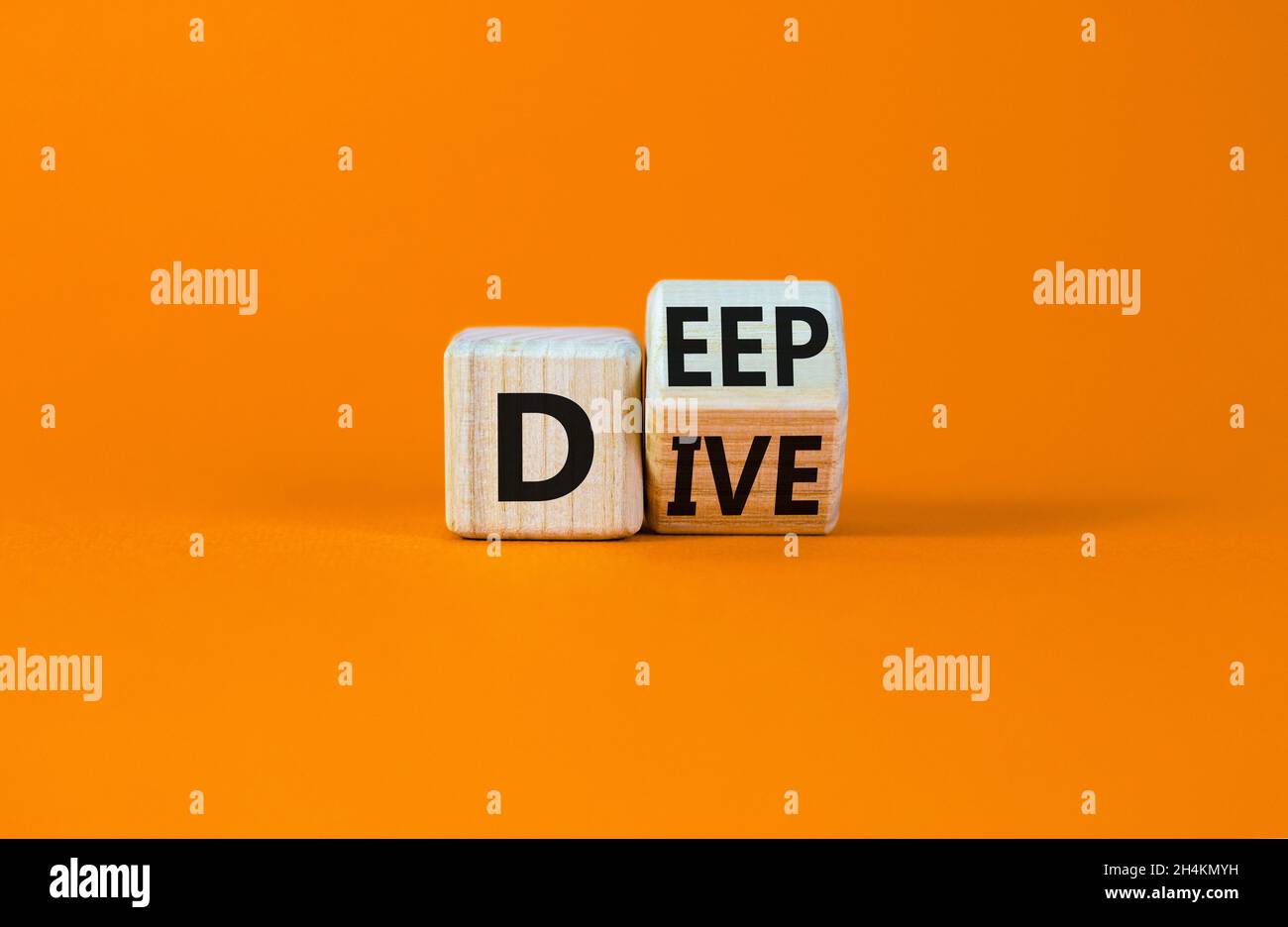 Deep dive symbol. Turned a wooden cube with words 'Deep dive ...