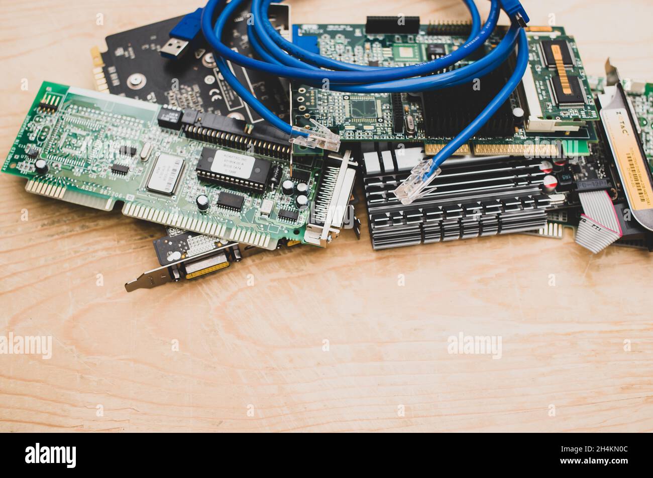 electronic devices integrated circuit boards and cables piled up on a ...