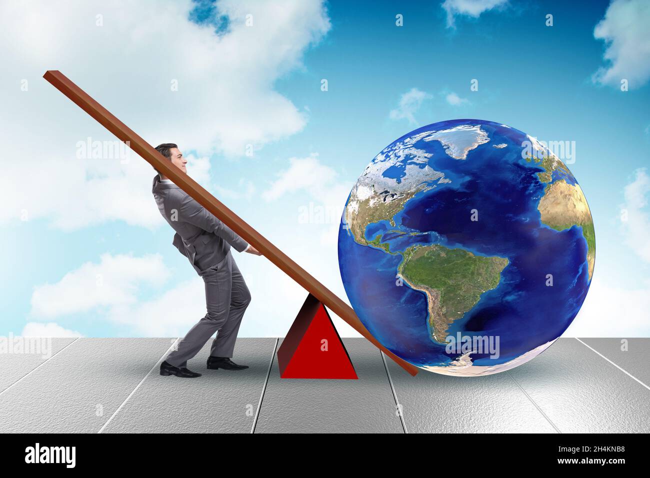 Businessman lifting the earth in the challenge concept Stock Photo - Alamy