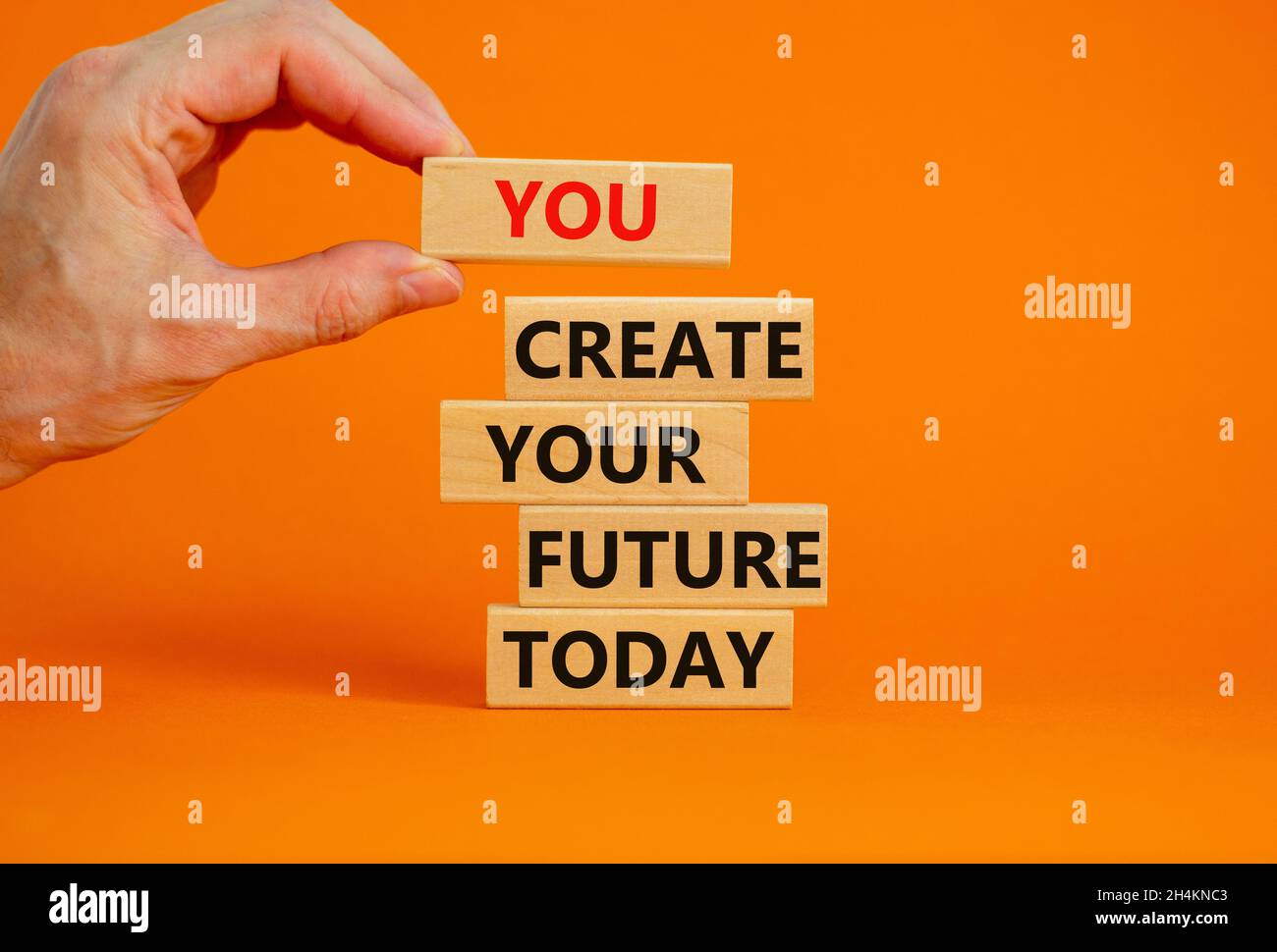 You create your future today symbol. Wooden blocks, words 'You create ...