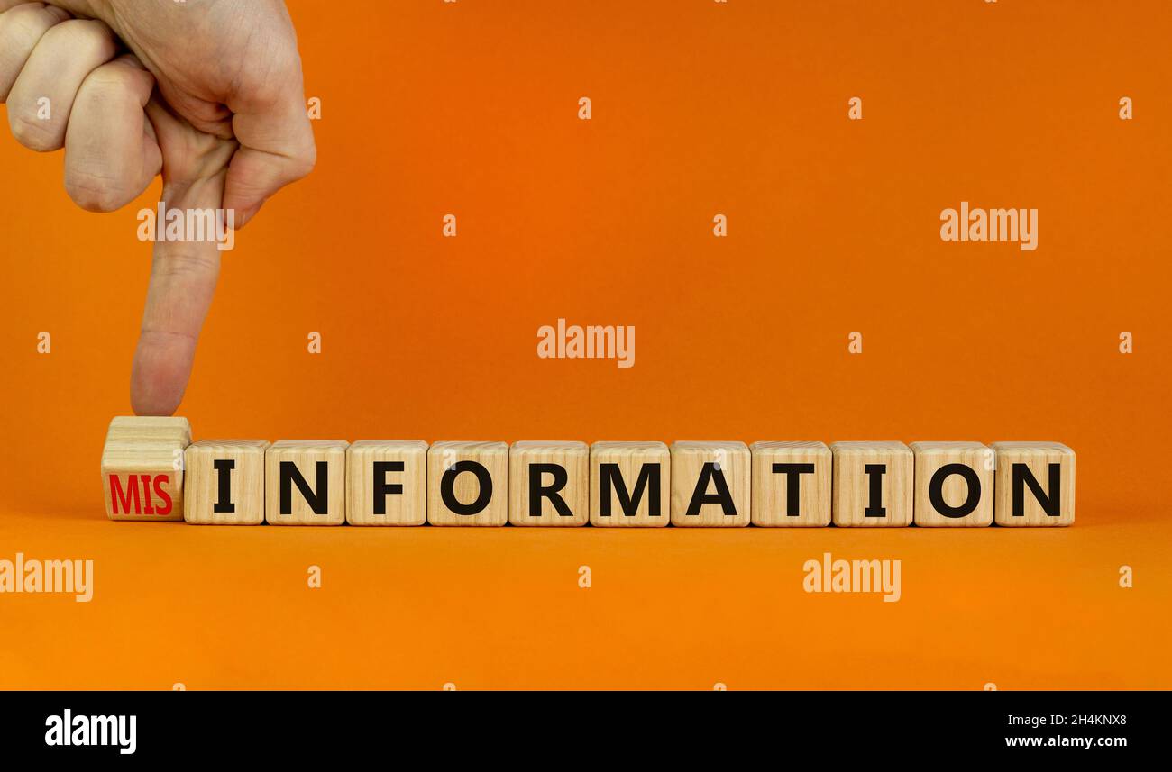 Information or misinformation symbol. Businessman turns cubes and ...