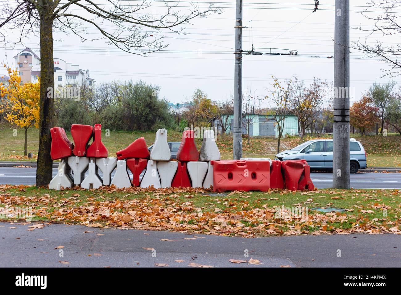 Red and white plastic road barriers. Construction props Stock Photo - Alamy