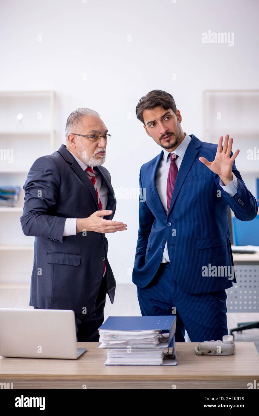 Two colleagues working in the office Stock Photo - Alamy