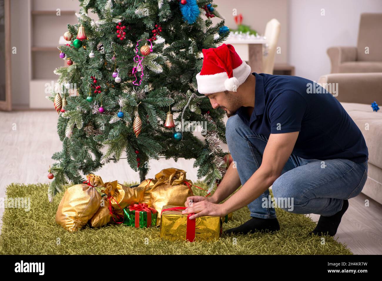 Young man celebrating New year at home alone Stock Photo - Alamy