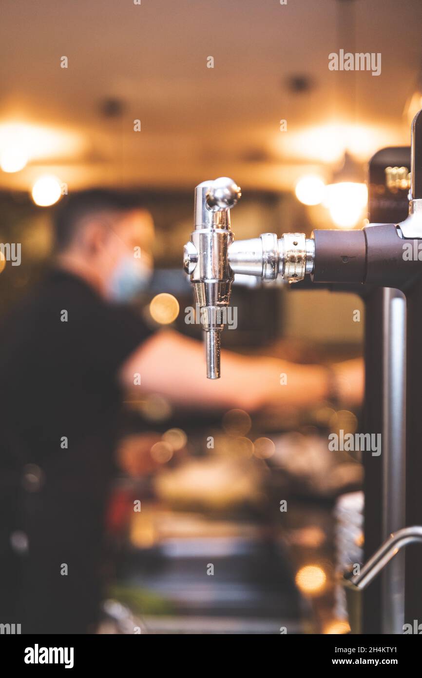 Beer shooter with unfocused background of a bar Stock Photo - Alamy