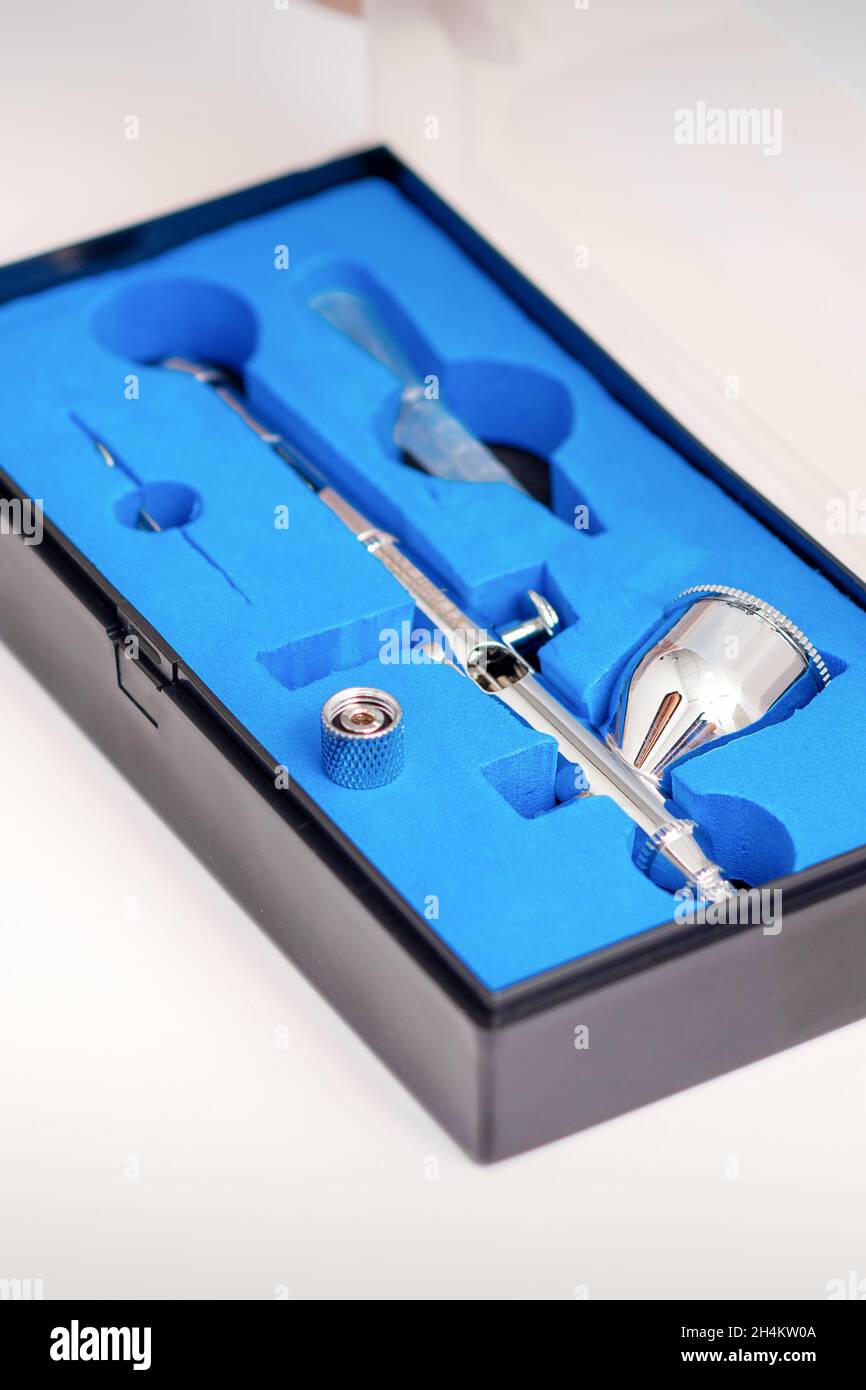 Close up of new clean airbrush tool in the blue box Stock Photo - Alamy