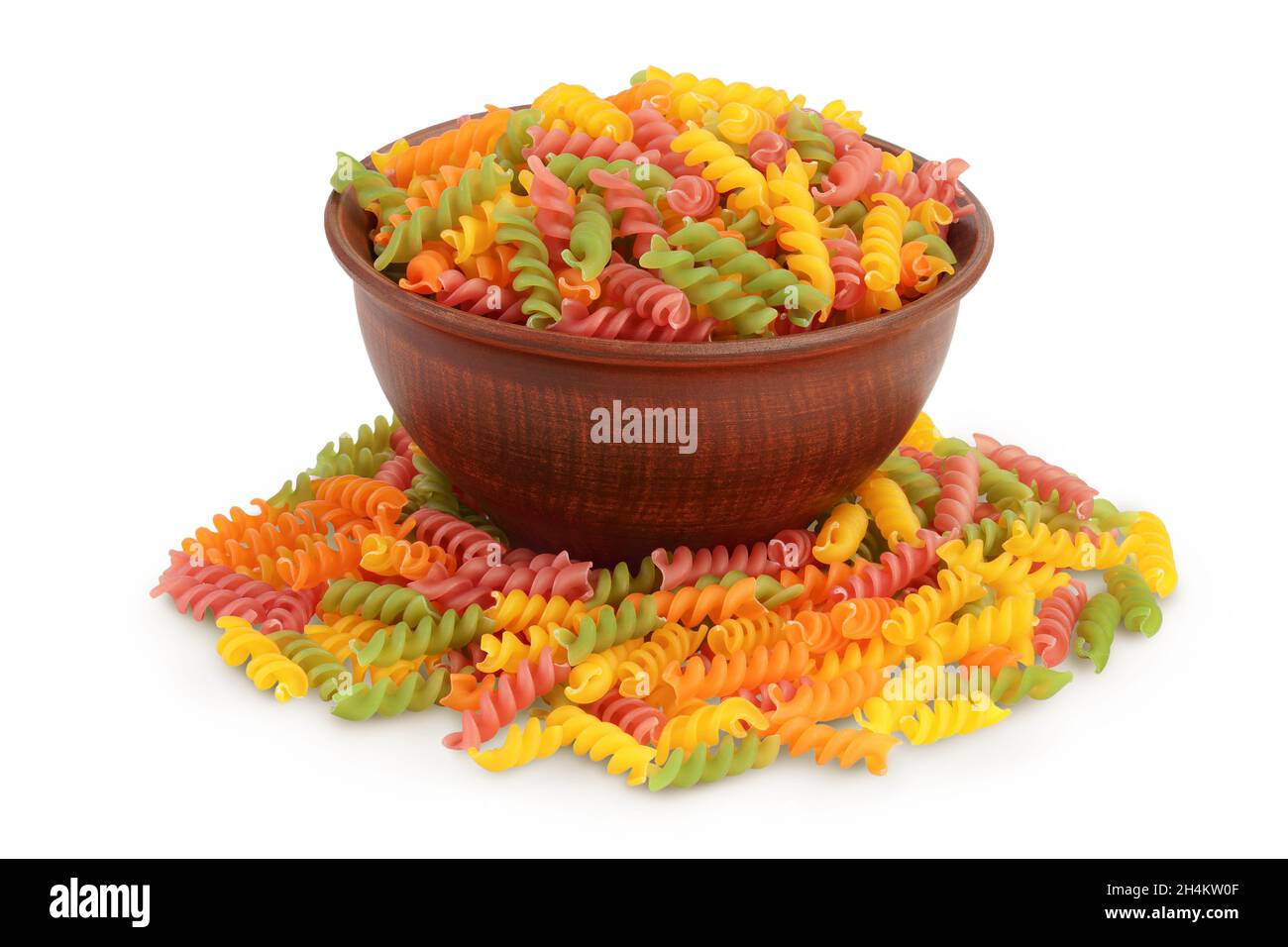 raw Fusilli in ceramic bowl colored pasta, isolated on white background ...
