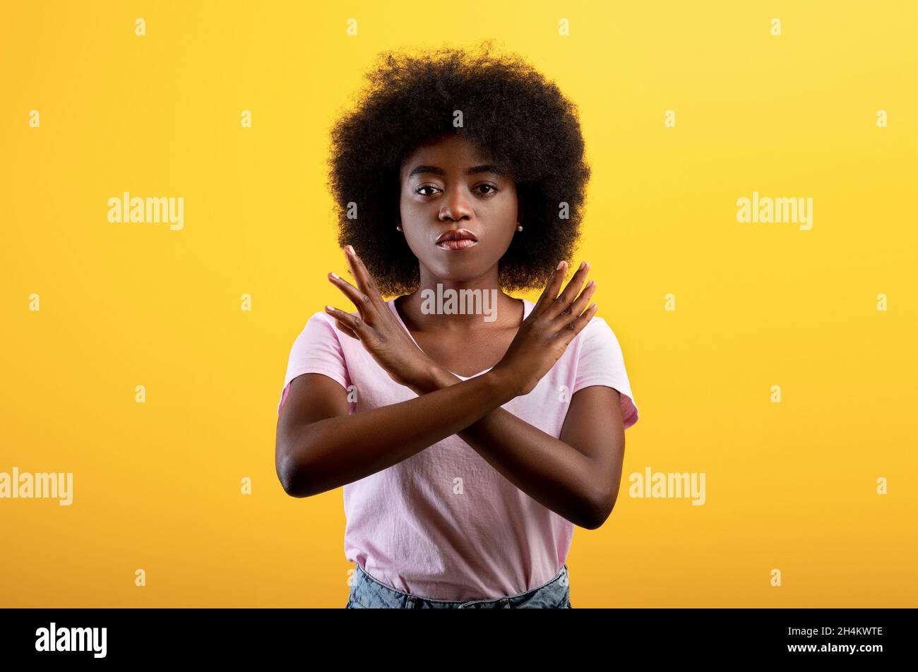 Refusal concept. Upset black lady showing stop gesture with crossed ...