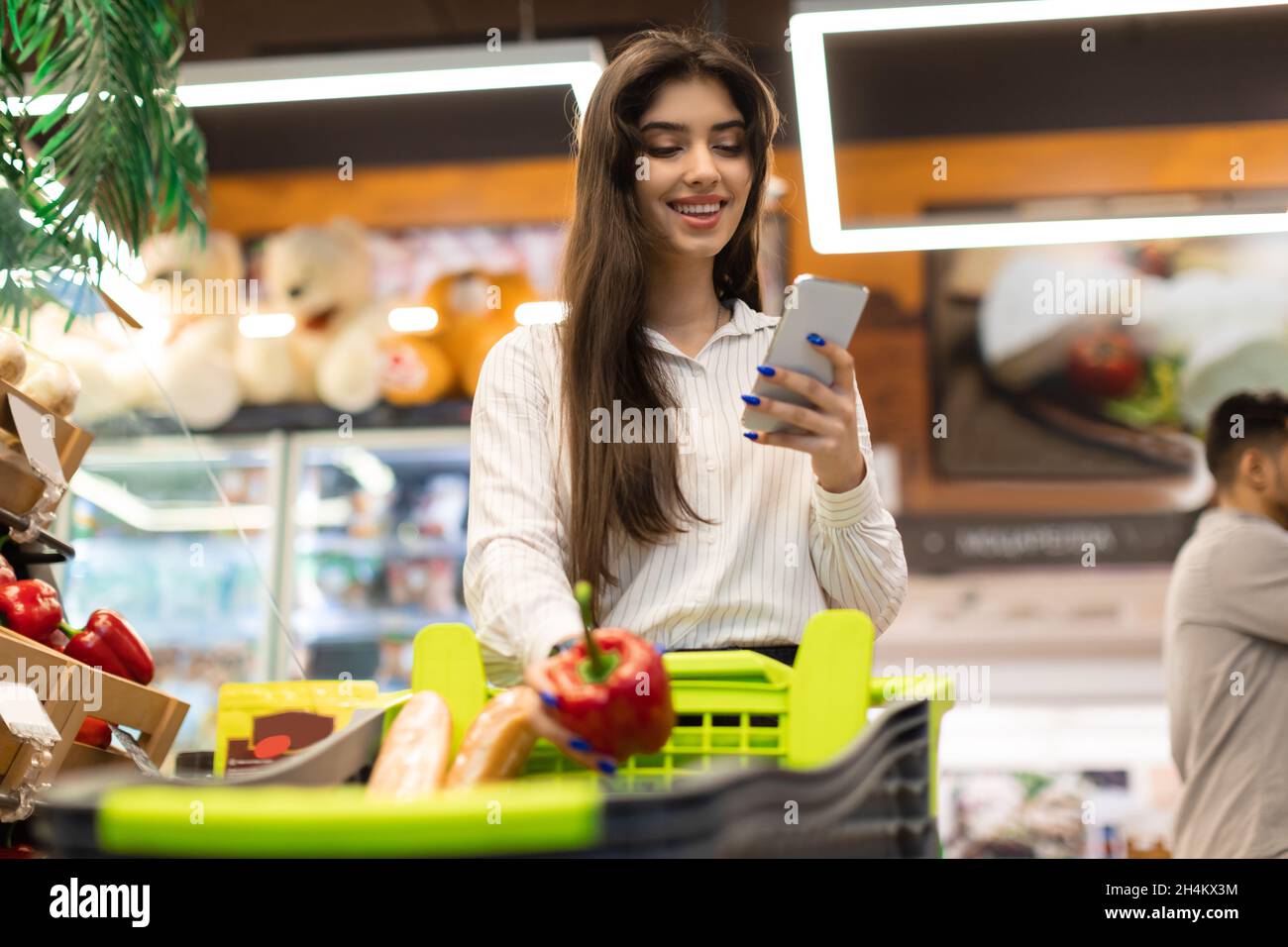 Arabic Female Buyer Using Mobile Phone Shopping Groceries Buying ...