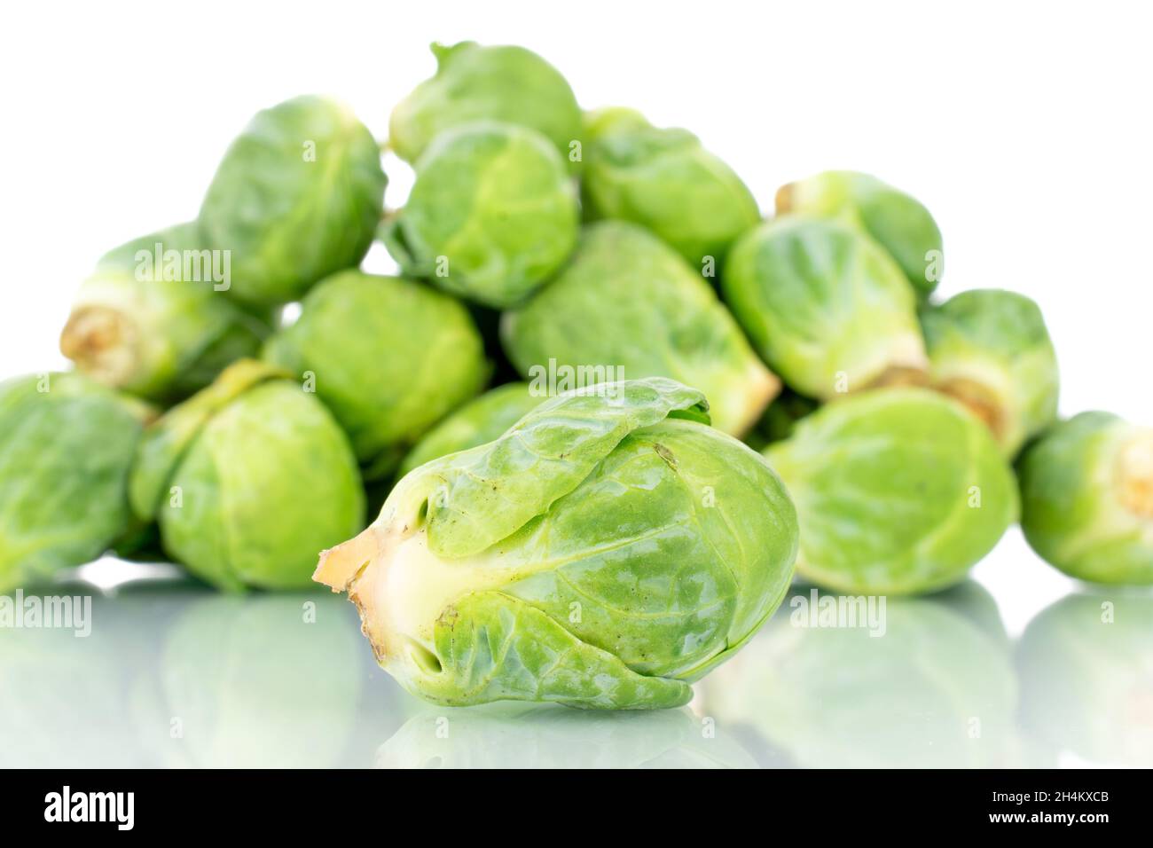 Organic ripe brussels sprouts, close-up, isolated on white Stock Photo ...