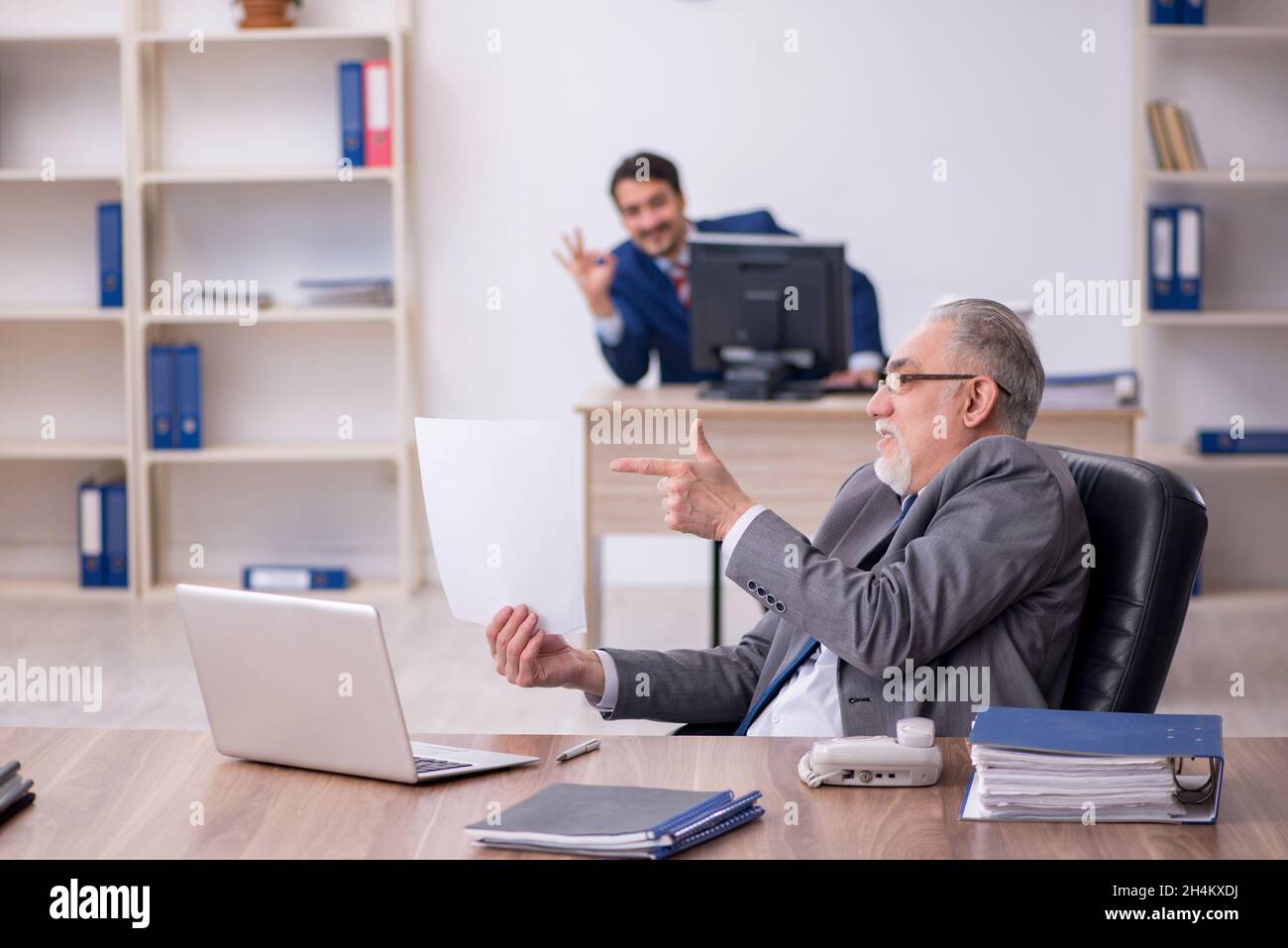 Two employees working in the office Stock Photo - Alamy