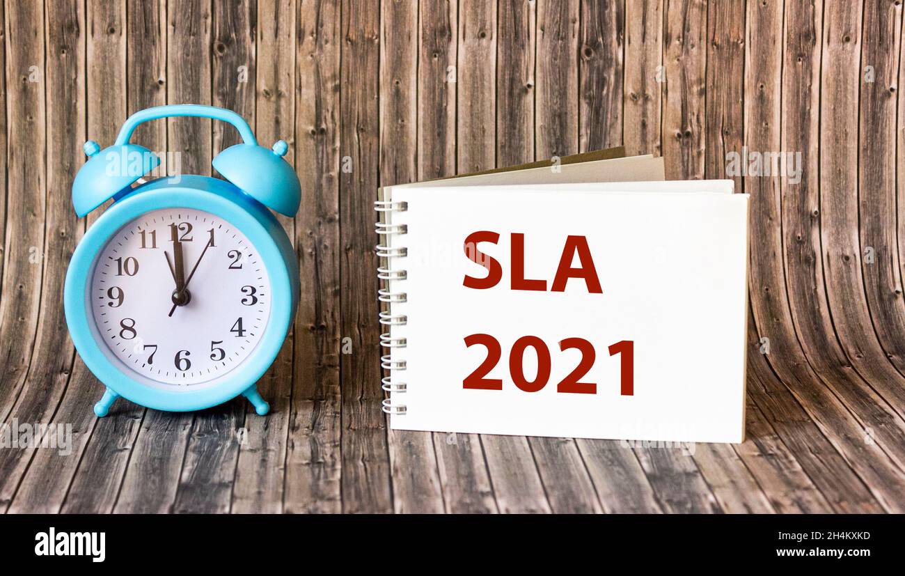 Service Level Agreement SLA 2021 - word on notepad and wooden ...