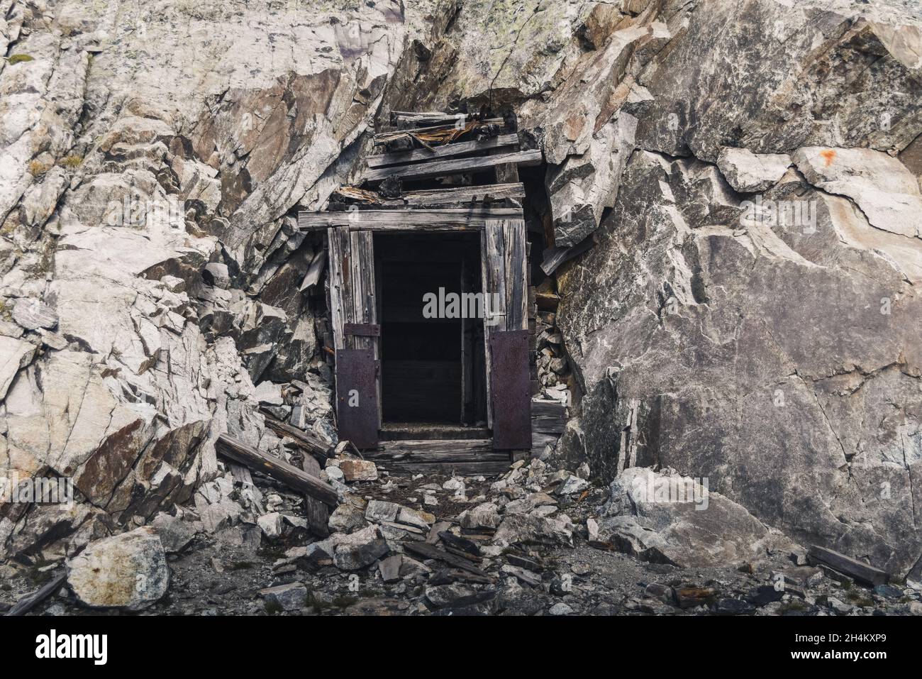 An opening in the side of a mountain from a mine Stock Photo - Alamy