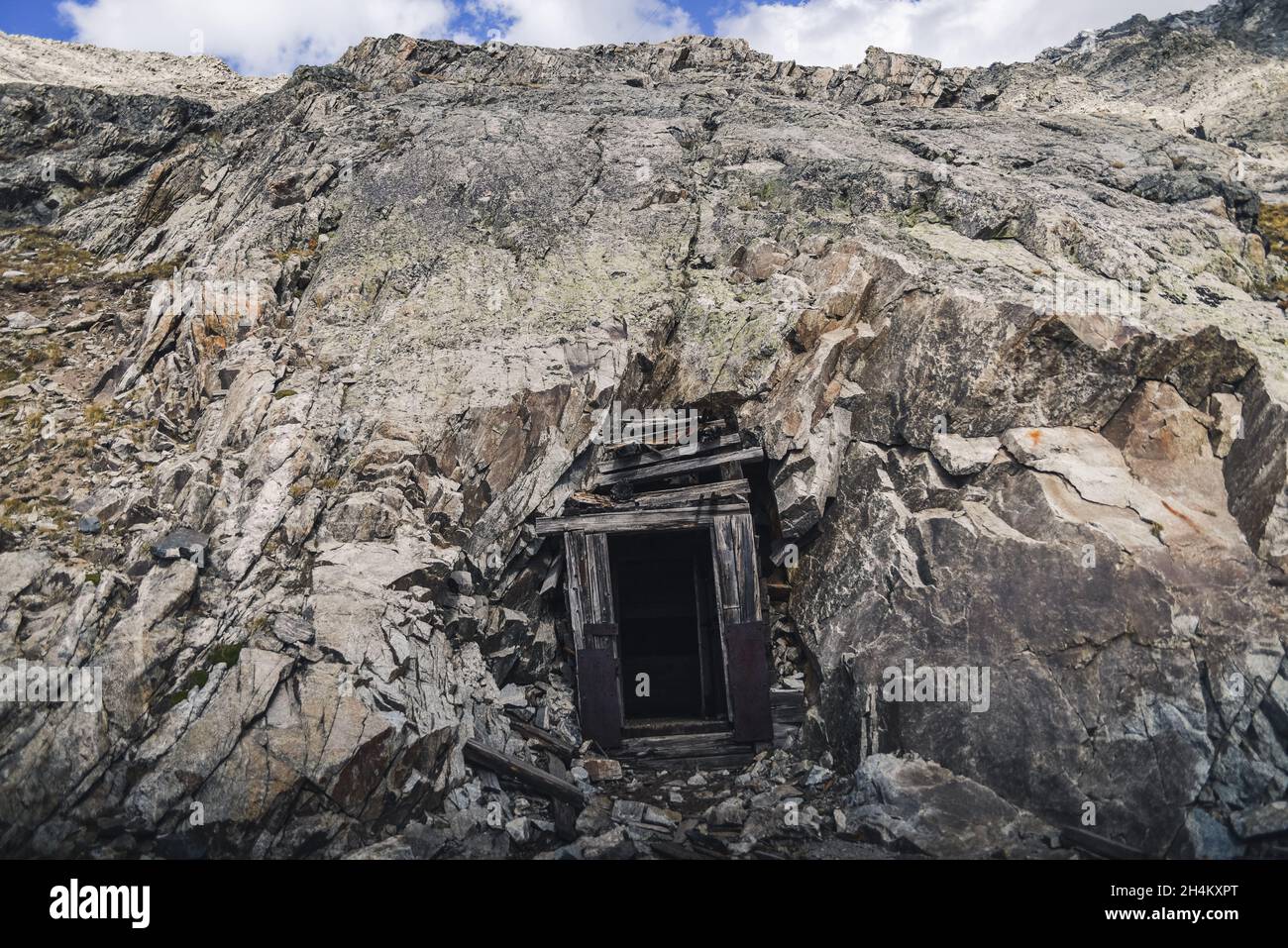 An opening in the side of a mountain from a mine Stock Photo - Alamy