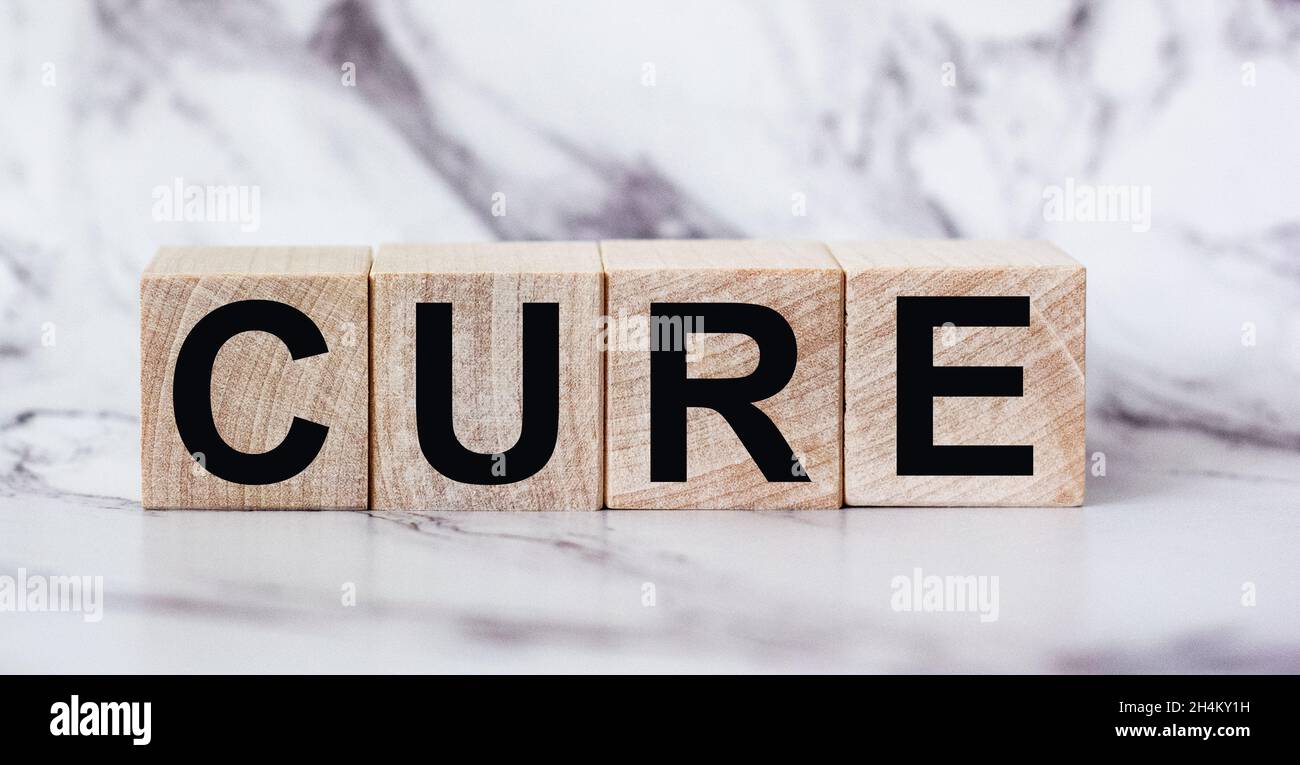 Cure- text on wooden blocks, medical concept, light background Stock ...