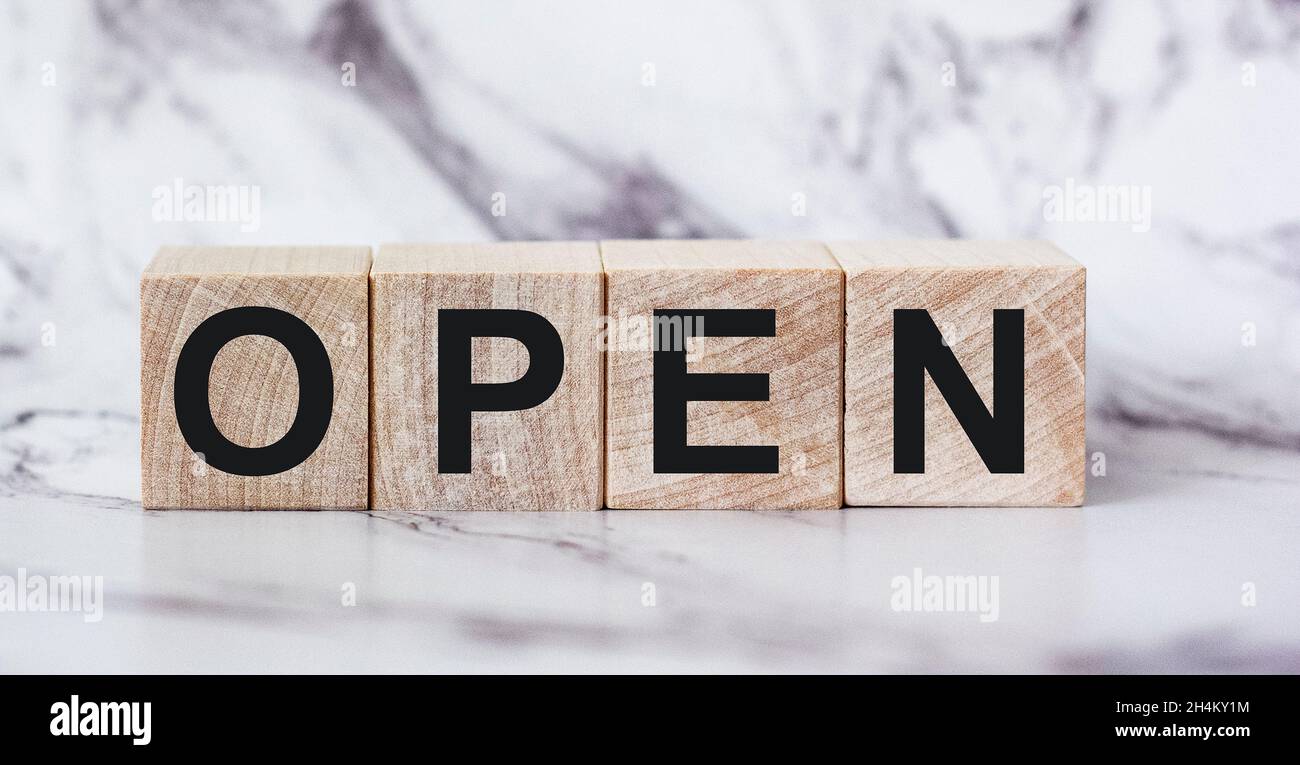 Word OPEN on wooden blocks or cubes. Opening business concept Stock ...