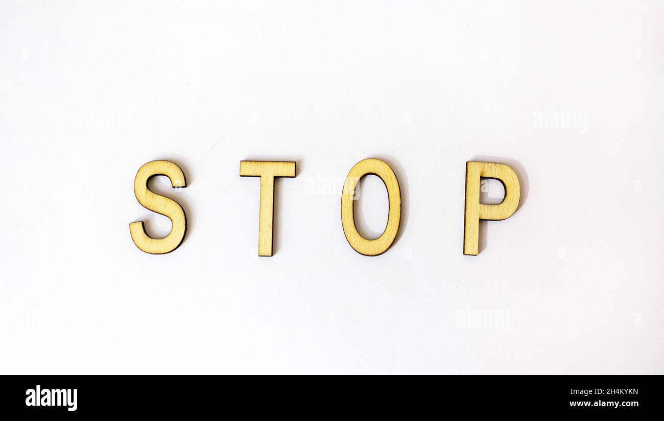 Wooden letters with the word STOP, on a white background Stock Photo ...
