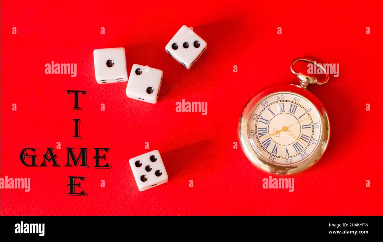 Game time text .Chance concept, retro clock and dice on red background ...