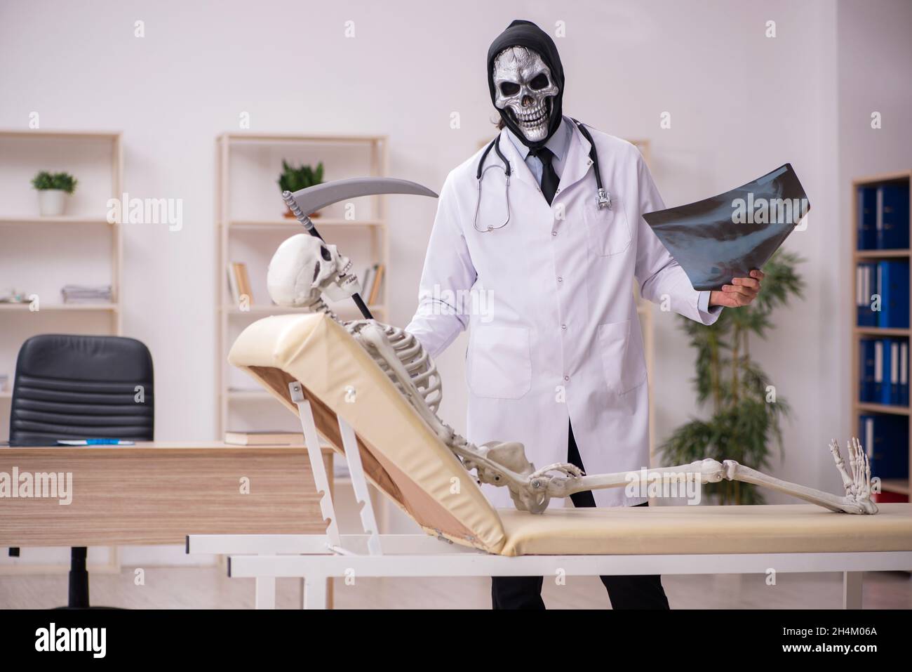 Devil doctor radiologist examining skeleton patient at the hospital ...