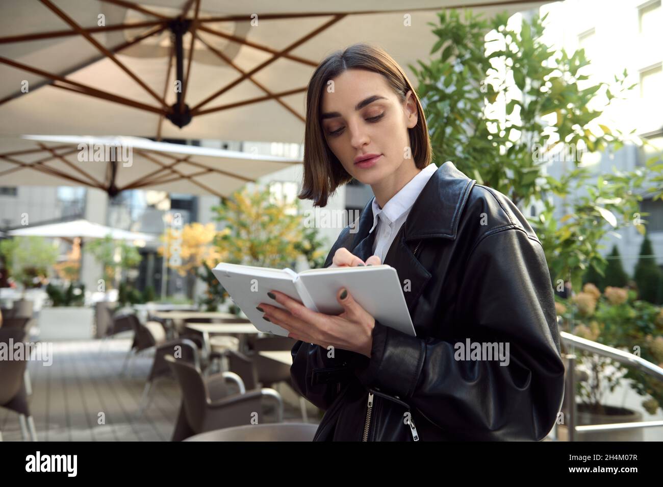 Close-up confident portrait of concentrated beautiful young business ...