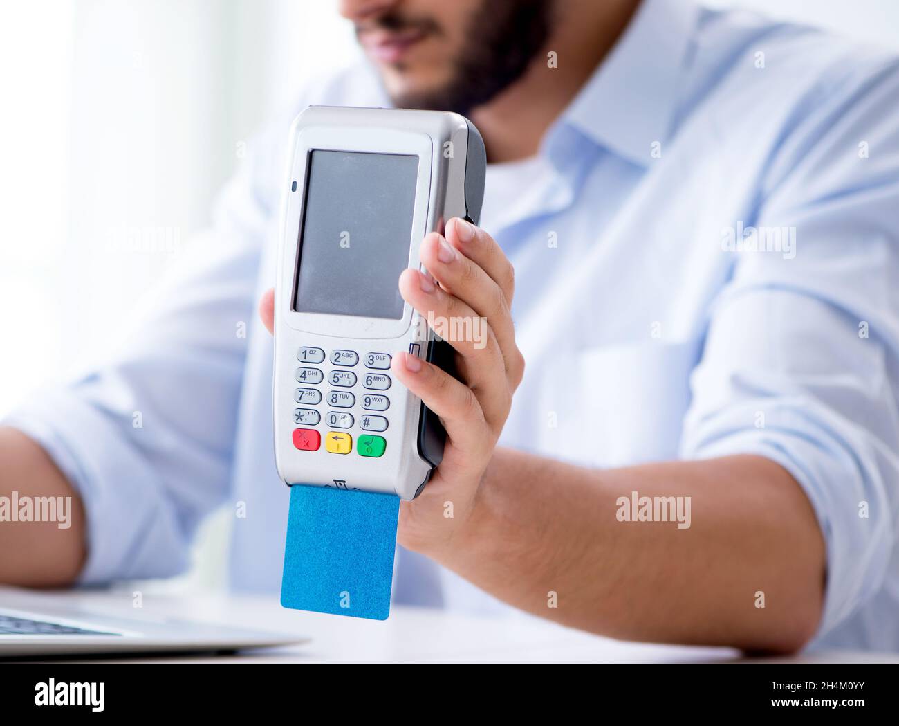 Man processing credit card transaction with the POS terminal Stock ...