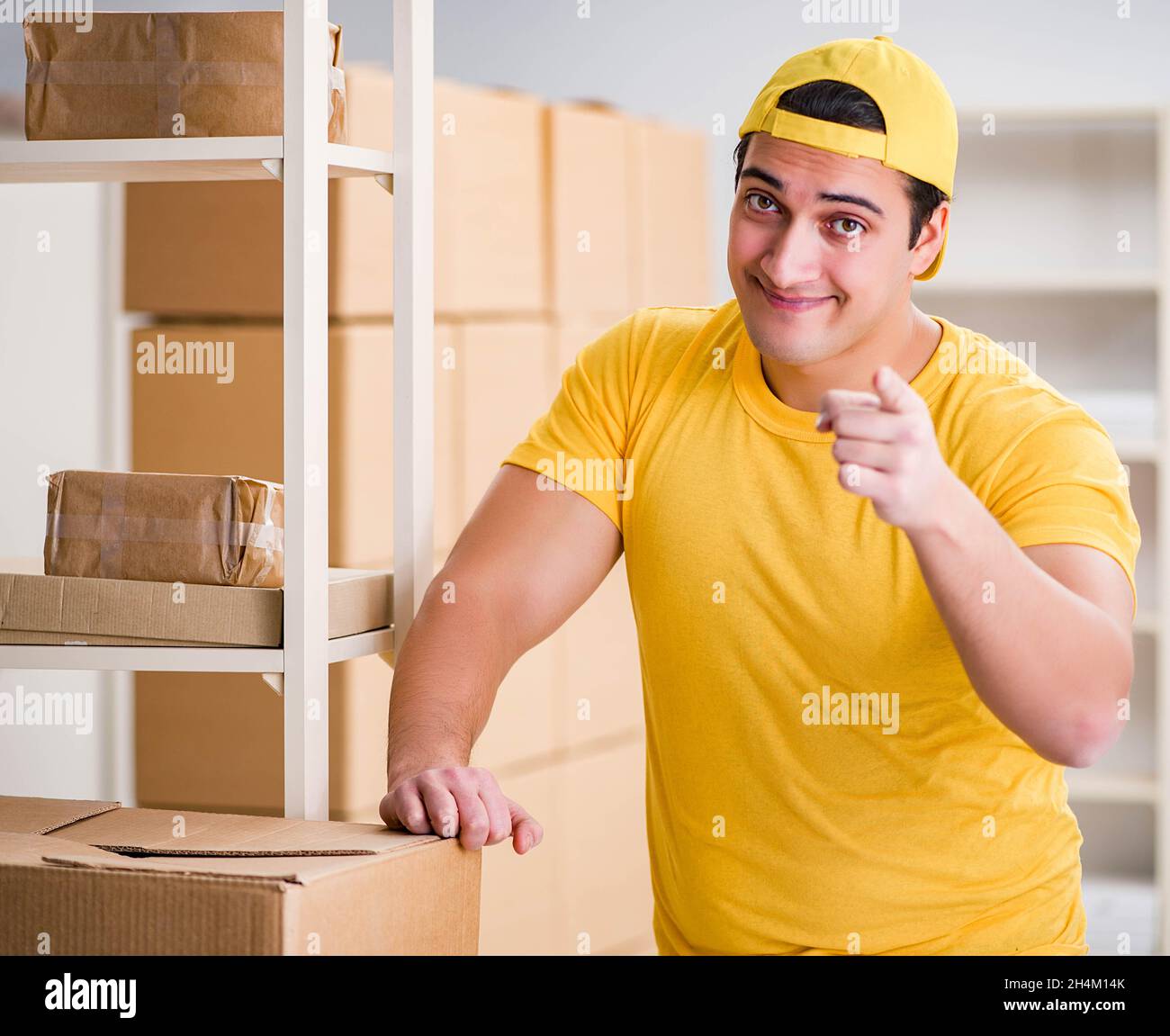 The man working in postal parcel delivery service office Stock Photo ...