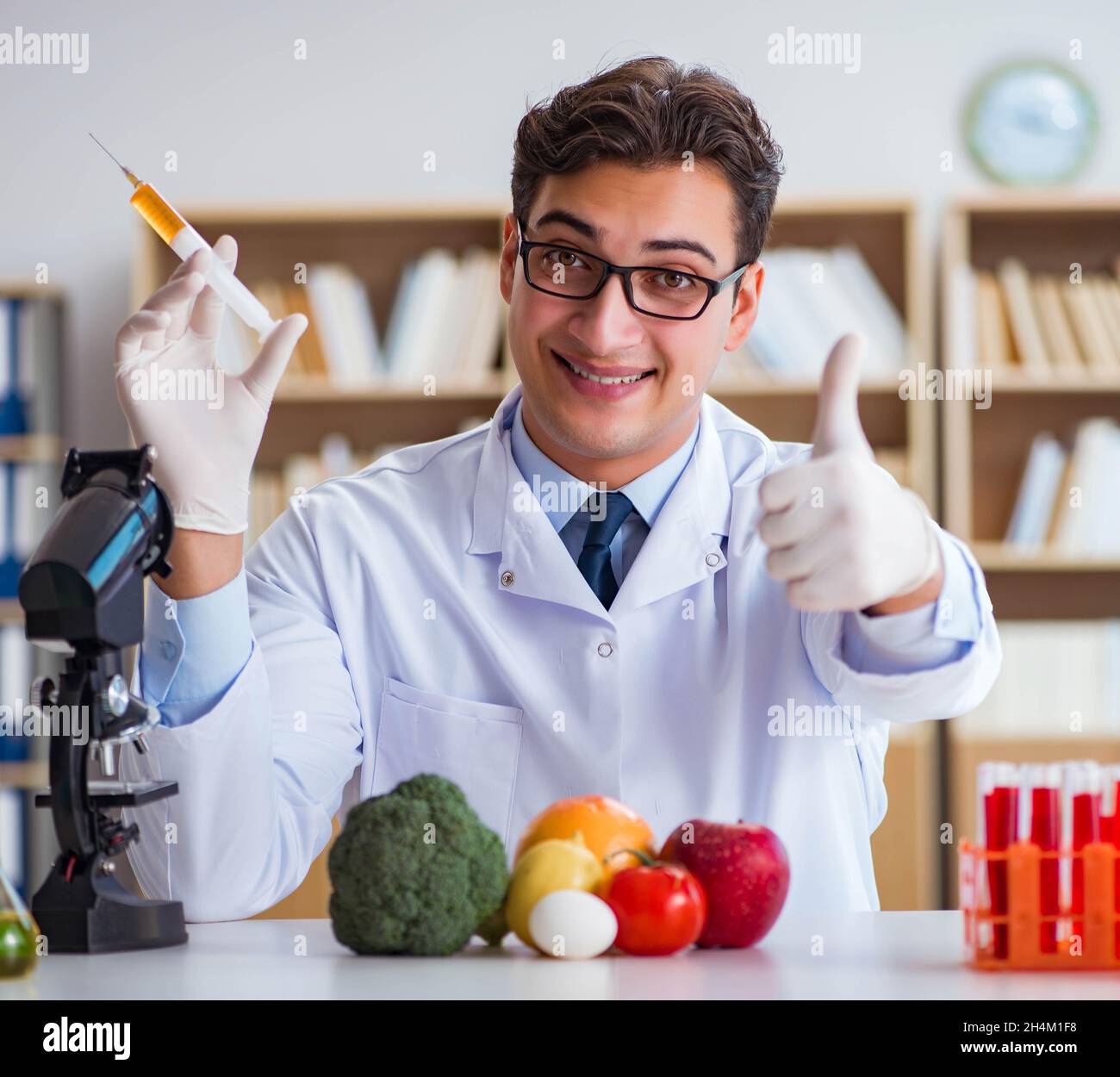 The man doctor checking the fruits and vegetables Stock Photo - Alamy