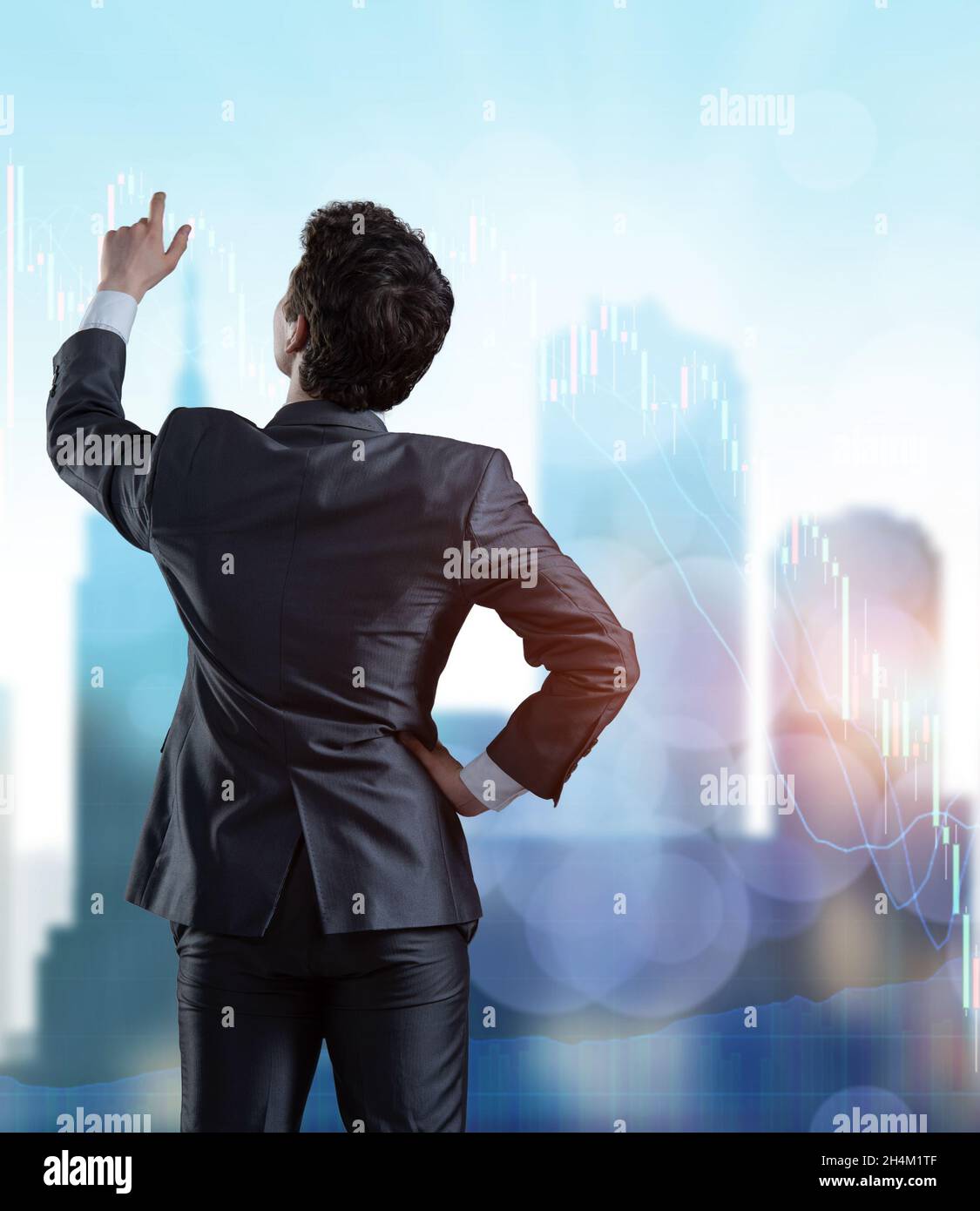 The man pressing buttons on line chart Stock Photo - Alamy