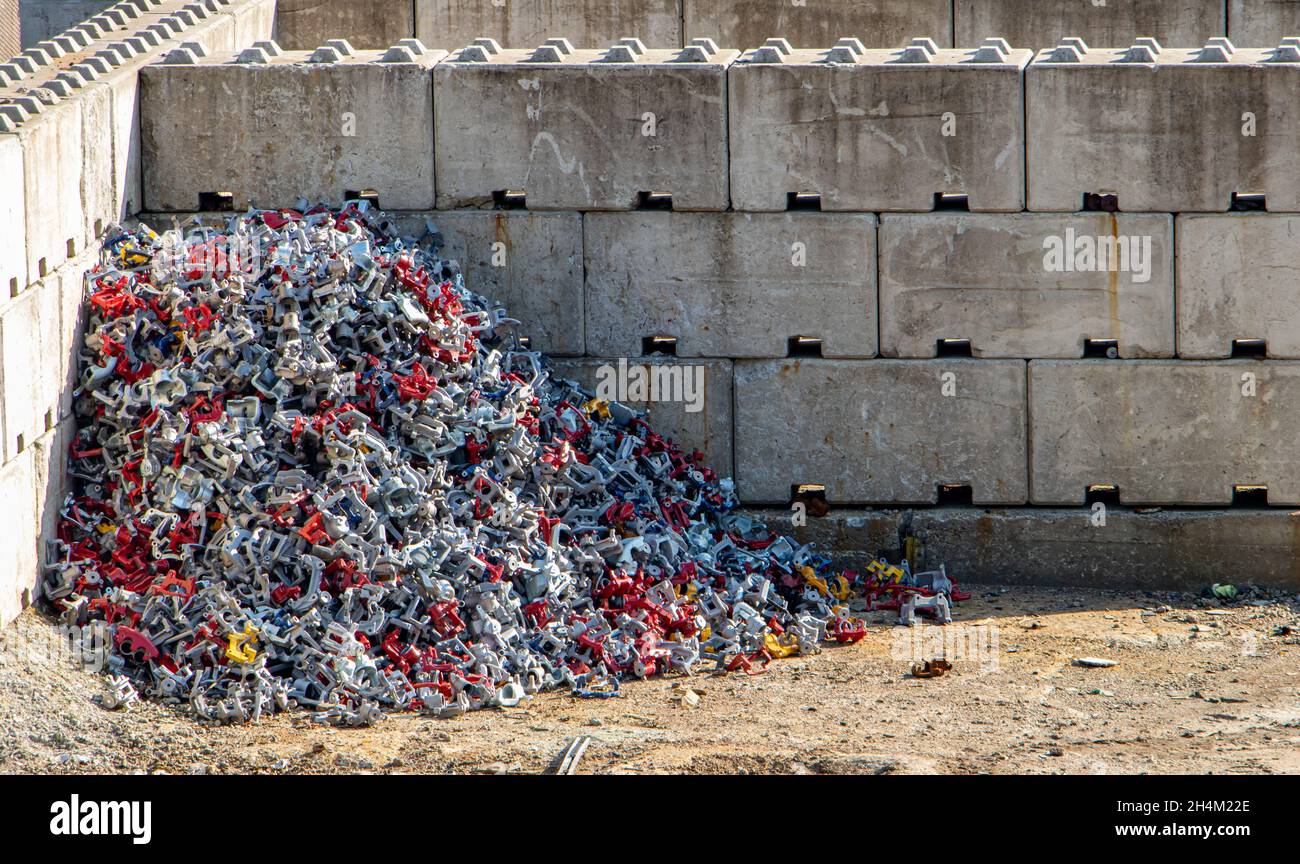 A discarded metal parts on a pile is separated in a storage space at ...