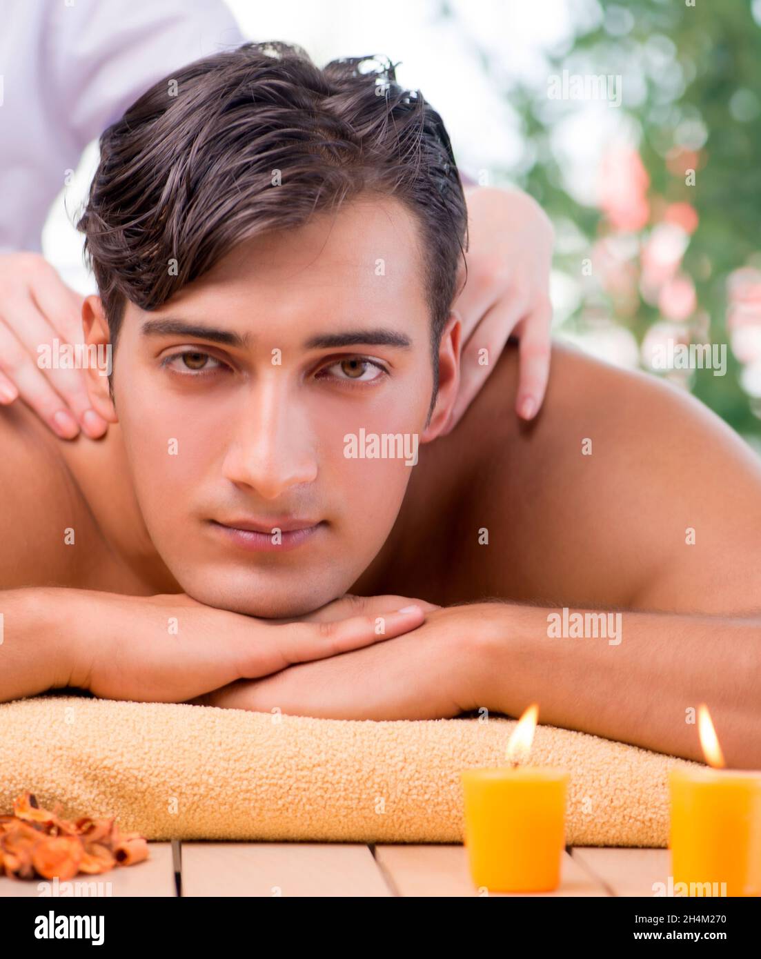 The young handsome man during spa procedure Stock Photo - Alamy