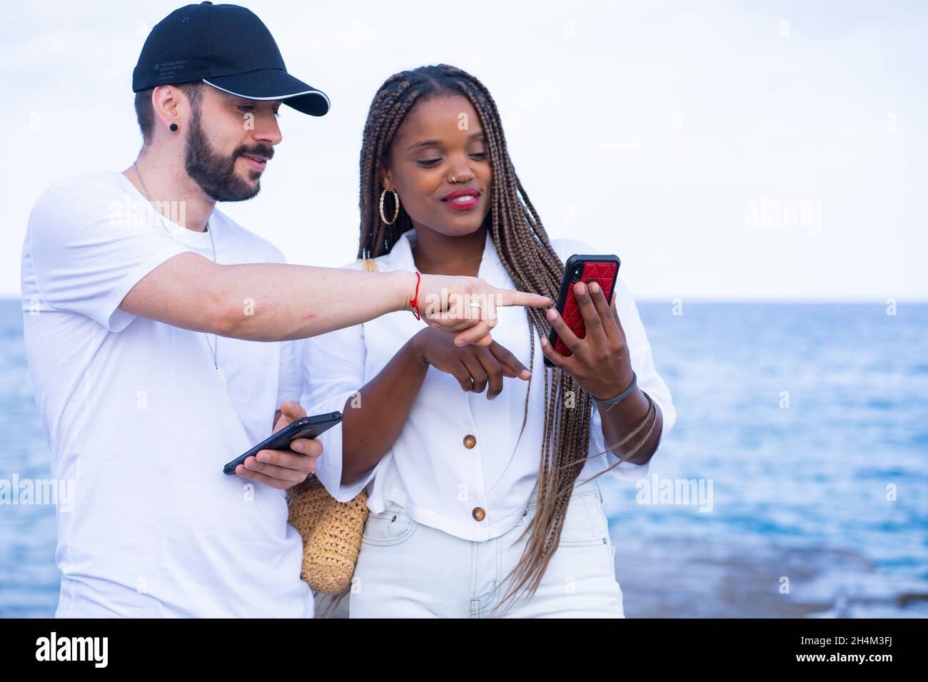 Two friends Laughing with Funny Media on Mobile Stock Photo - Alamy