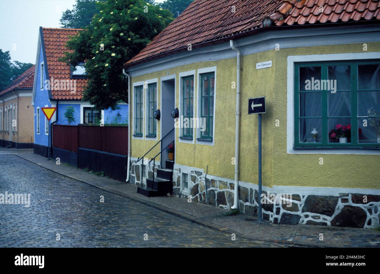 SIMRISHAMN, SWEDEN IN 1987, analog. Streetwie of buildings and walls in ...