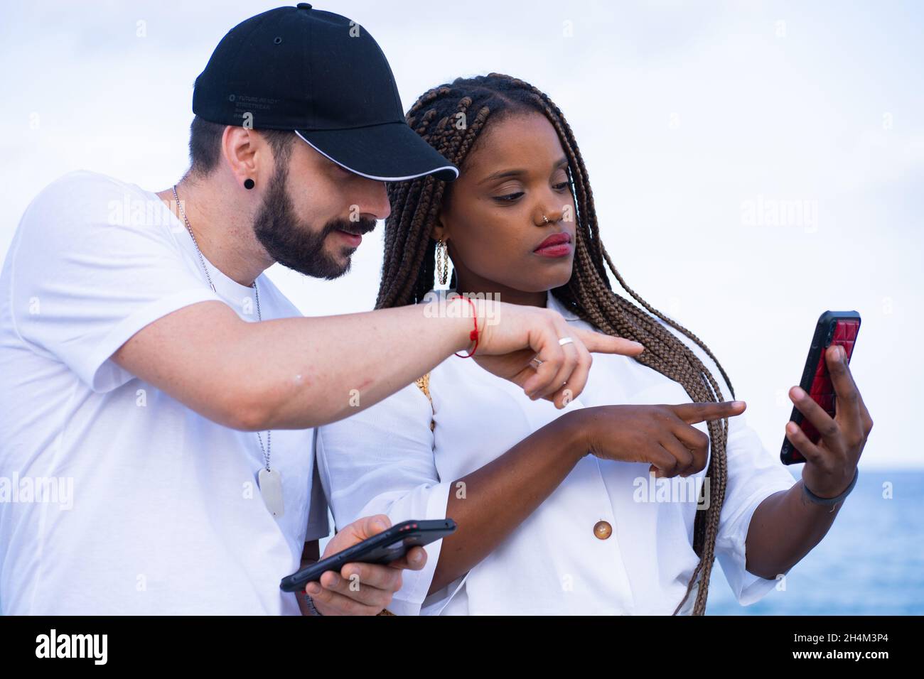 Two friends Laughing with Funny Media on Mobile Stock Photo - Alamy