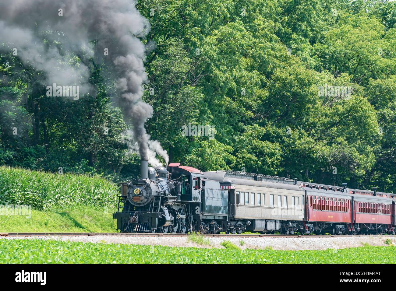 View of an Antique Restored Steam Passenger Train Blowing Smoke and ...