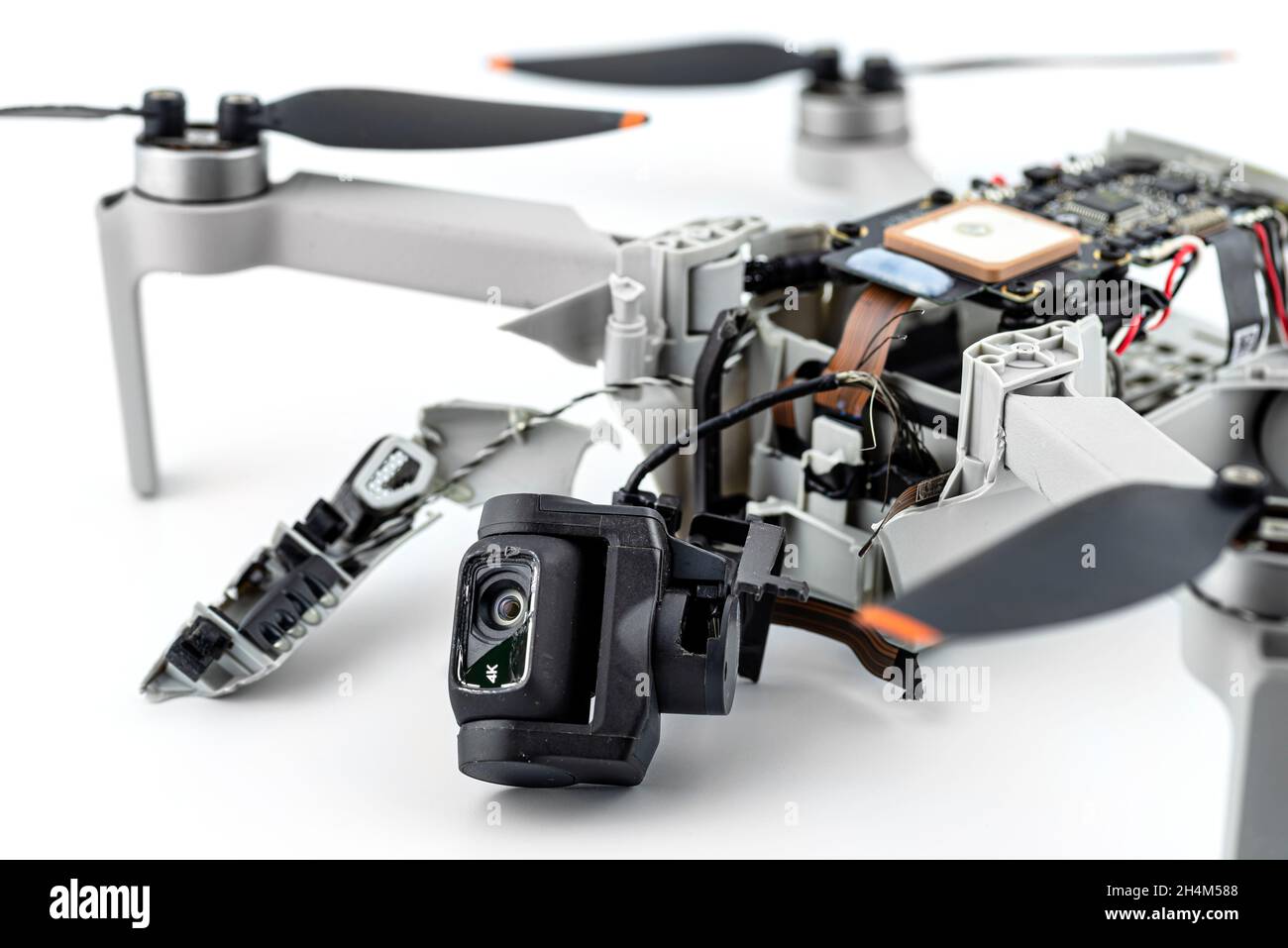 A broken drone after a fall with torn cables and a broken camera ...