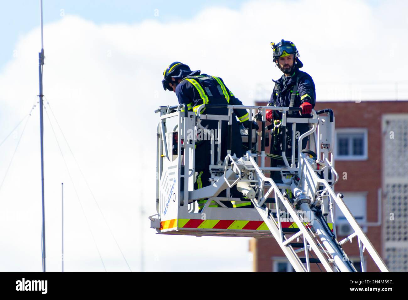 Firefighters climb ladder hi-res stock photography and images - Alamy