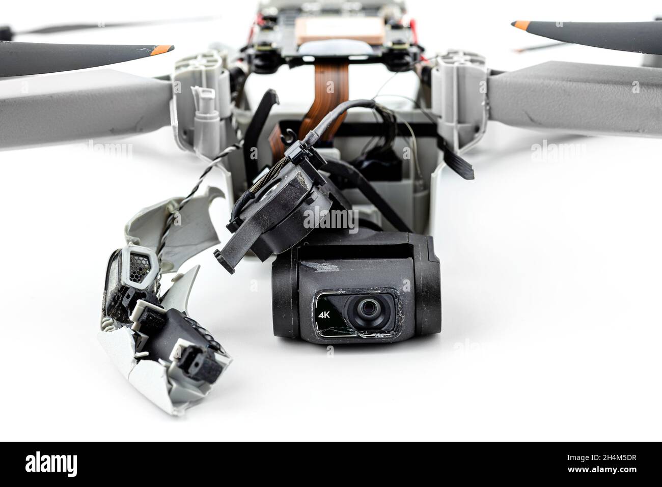 A broken drone after a fall with torn cables and a broken camera ...