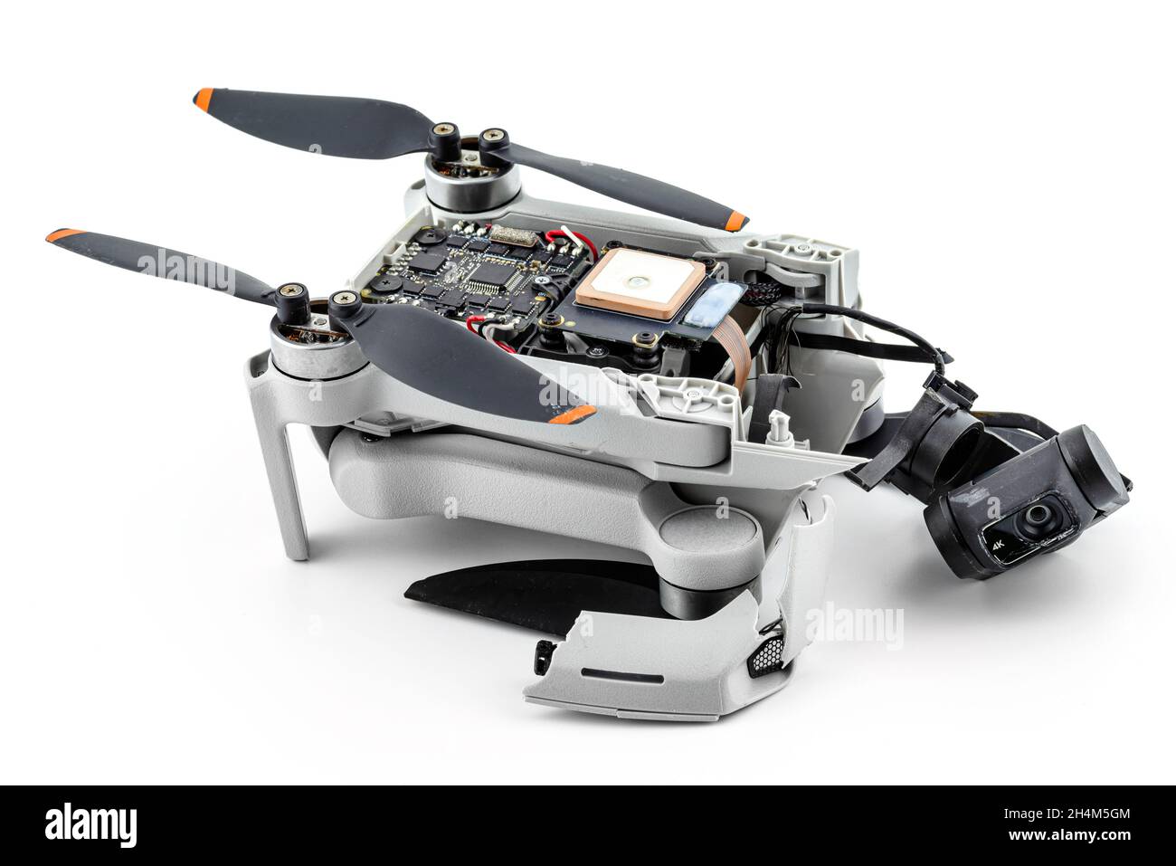 A broken drone after a fall with torn cables and a broken camera ...