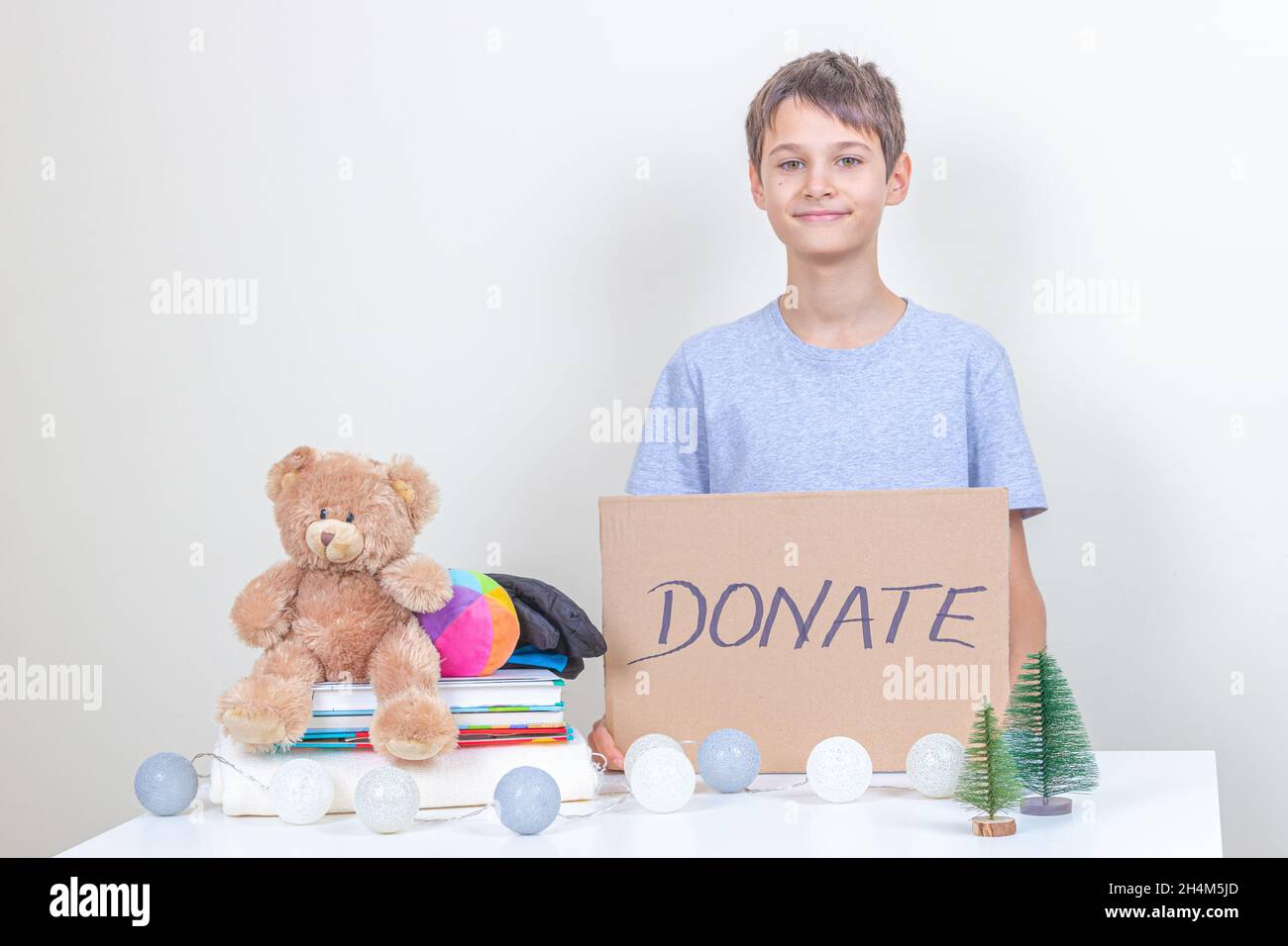 Christmas donation. Volunteer collect donation for children. Boy ...