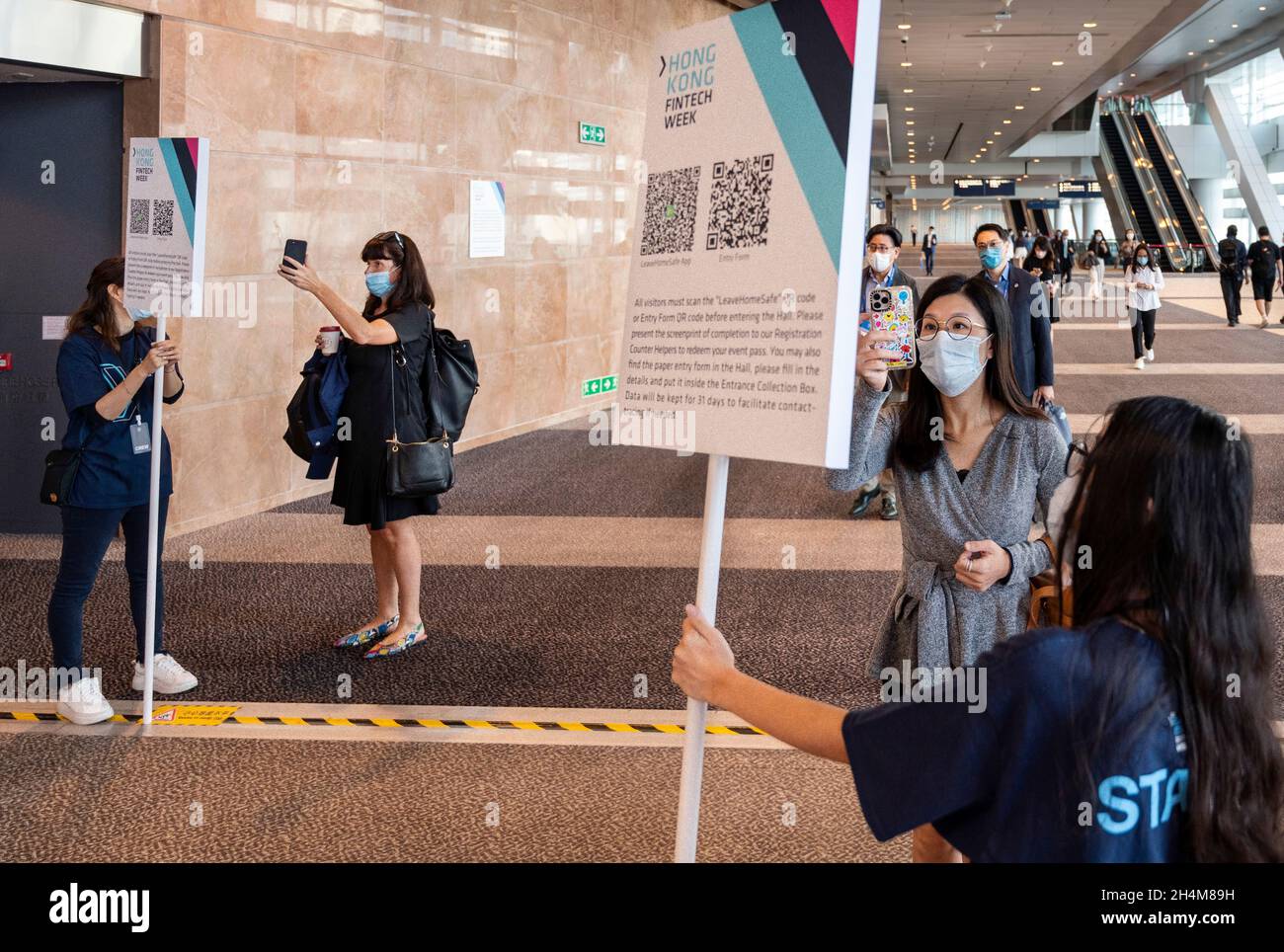 Visitors scan health QR code prior to entering the 2 days physical ...
