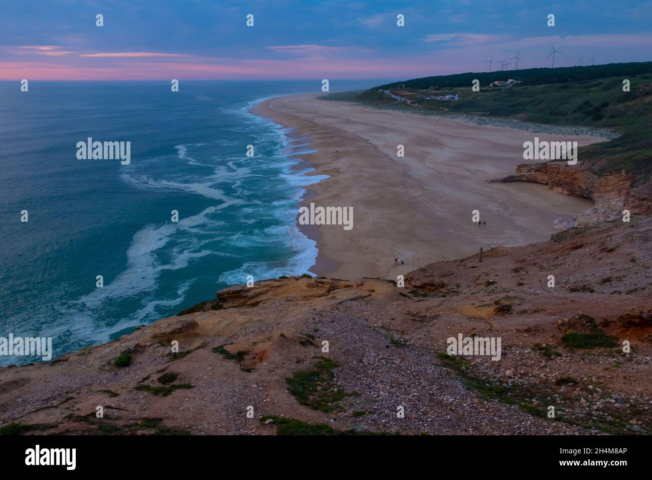Praia do Norte beach at sunset, Nazaré. Portugal Stock Photo - Alamy