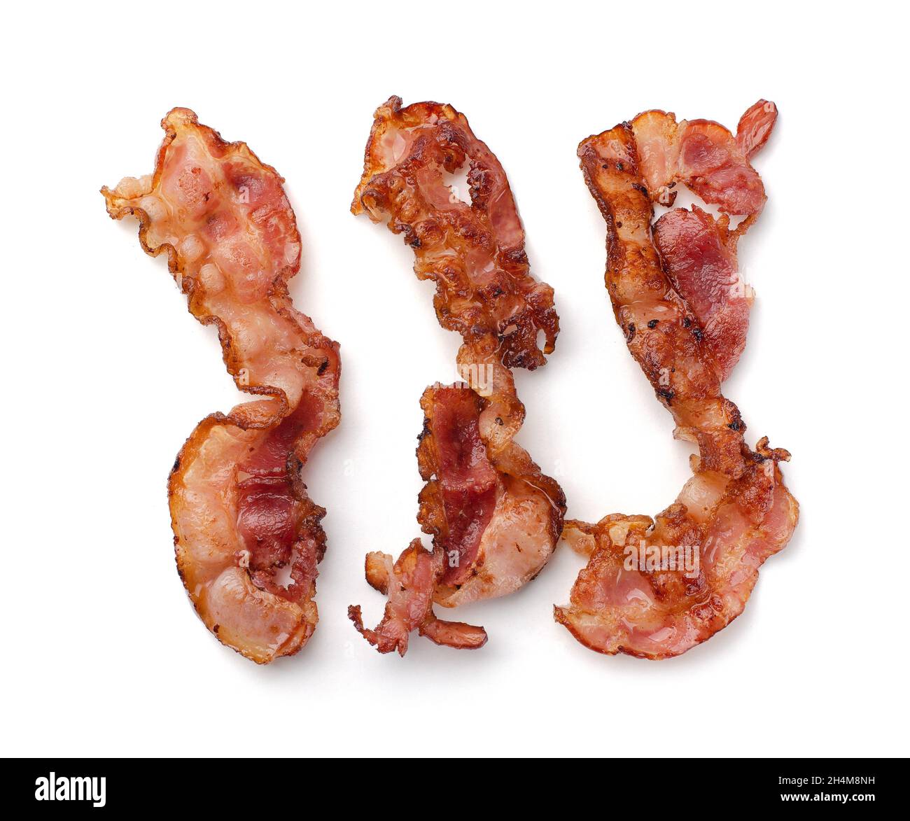 Three slices of fresh fried bacon lined up in a row isolated on a white ...
