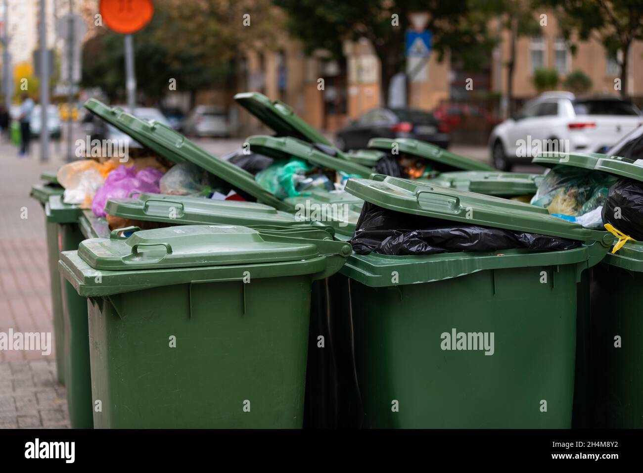 Close up picture of trash bin full of garbage on the streets of ...