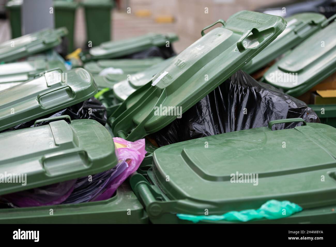 Close up picture of trash bin full of garbage on the streets of ...