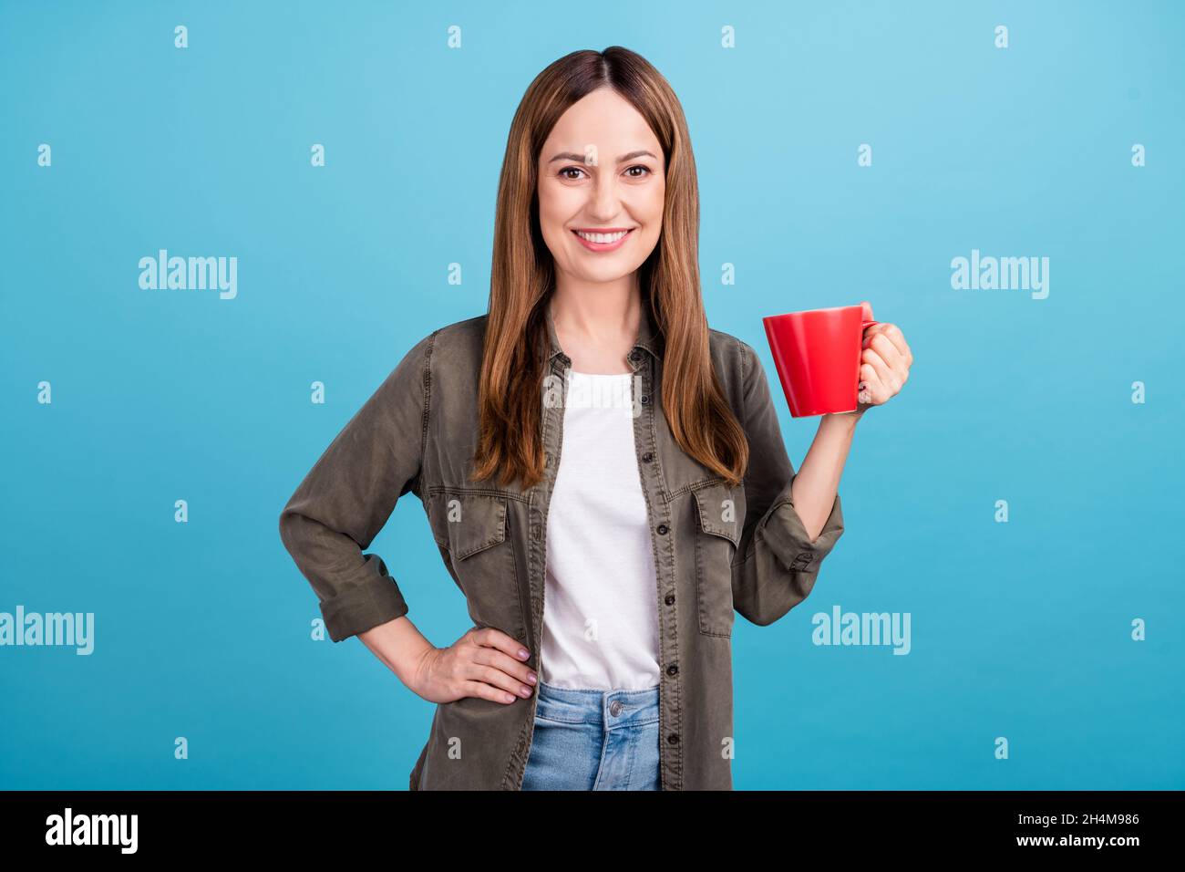 Photo of joyful pretty mature woman hold cup of tea good mood smile ...