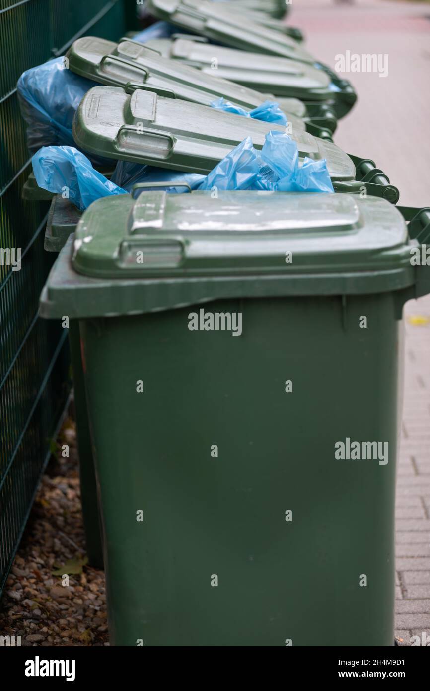 Close up picture of trash bin full of garbage on the streets of ...